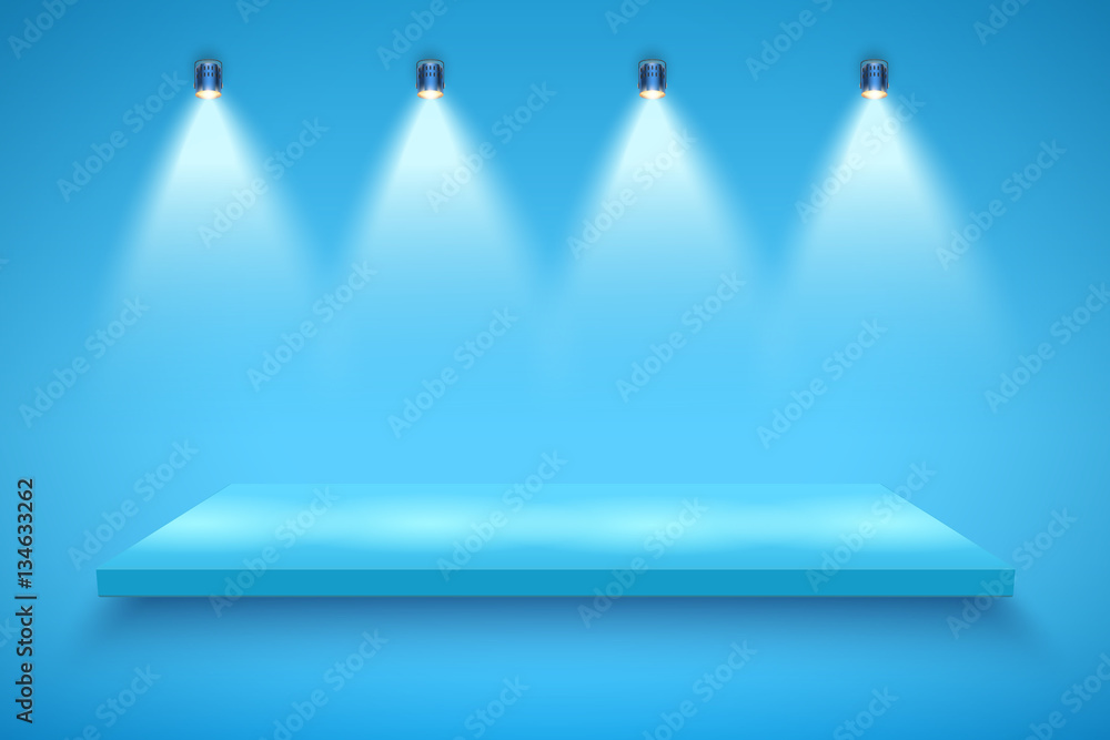 Light box with blue platform on blue backdrop with three spotlights ...