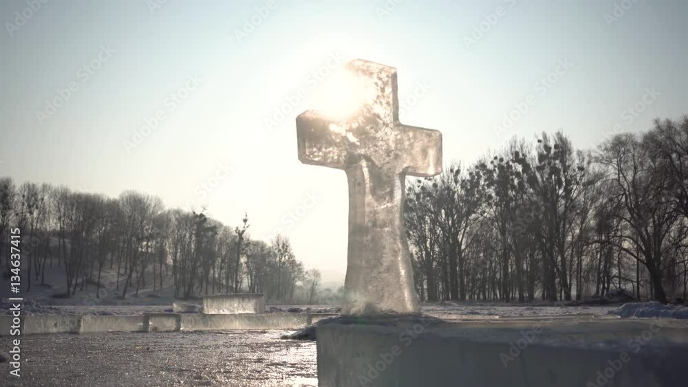 Sunny day shot of frozen ice cross sculpture on winter lake Stock Video ...