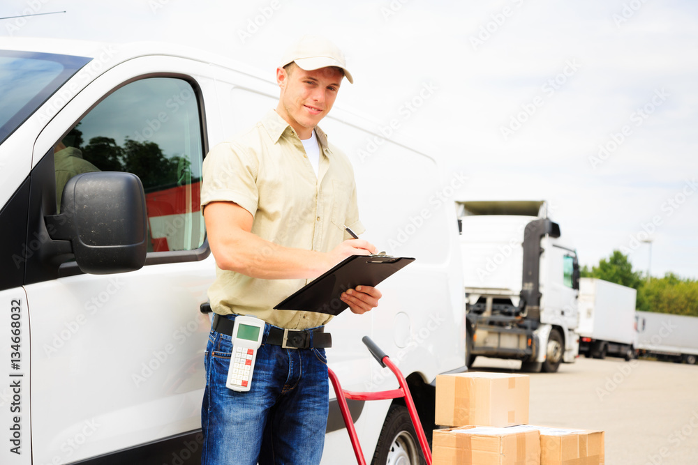Delivery Boy Standing Next To His Van Stock Photo | Adobe Stock