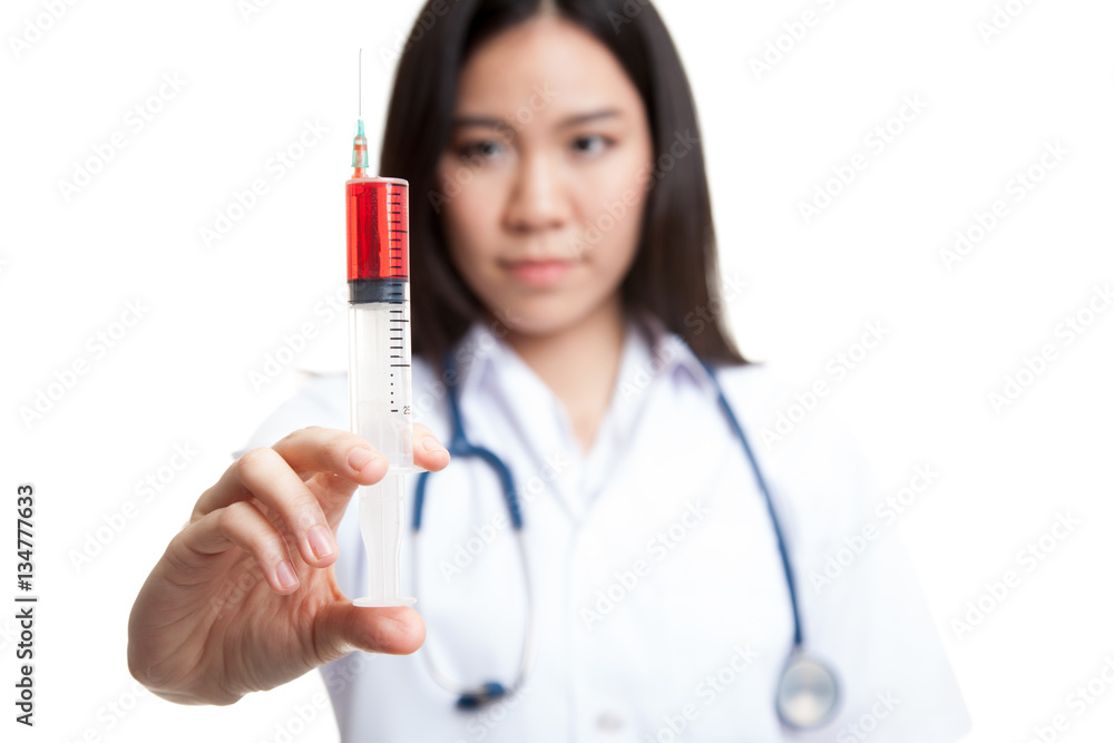Young Asian female doctor smile hold syringe focus at syringe. Stock ...