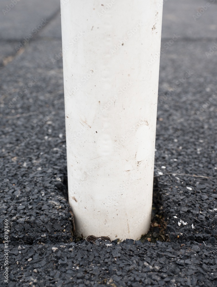 Pole in flexible tile for playground. Tiles made from a mixture of ...