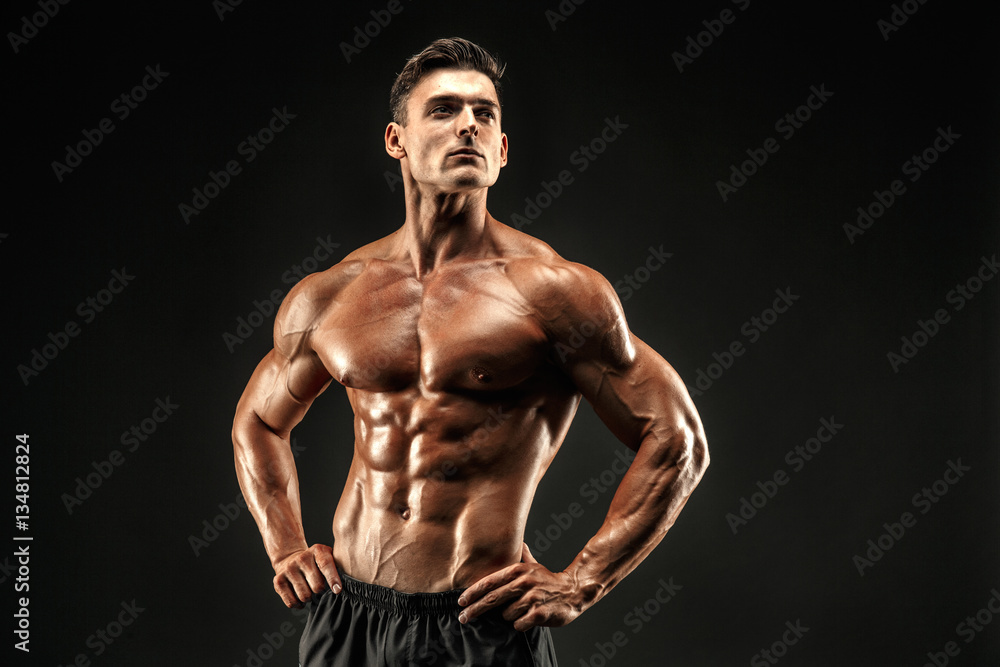 bodybuilder posing. Beautiful sporty guy male power. Fitness muscled ...