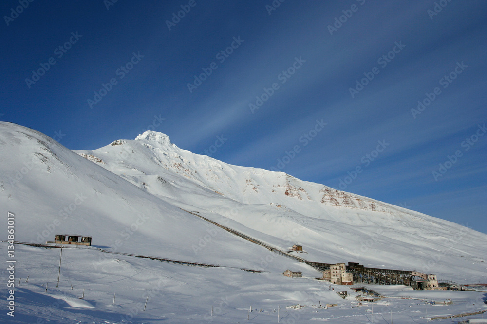 The colliery on the outskirts of the Soviet abandoned town Pyramiden ...