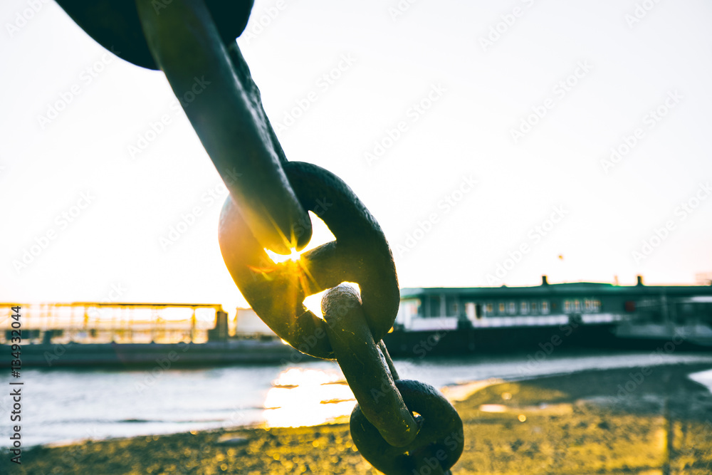 anchor chain on a background of the river bank and bridge Stock Photo ...