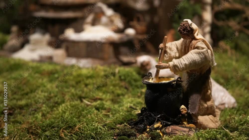 animated statuette of the crib of a woman who mixes the food in a ...
