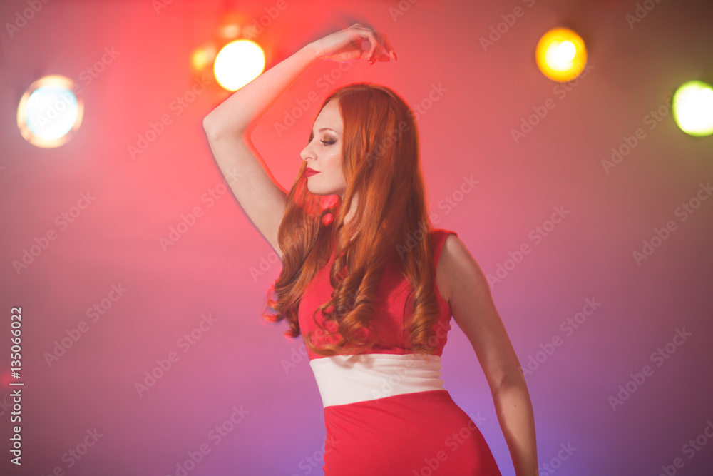 red-haired beautiful girl in a nightclub dancing Stock Photo | Adobe Stock