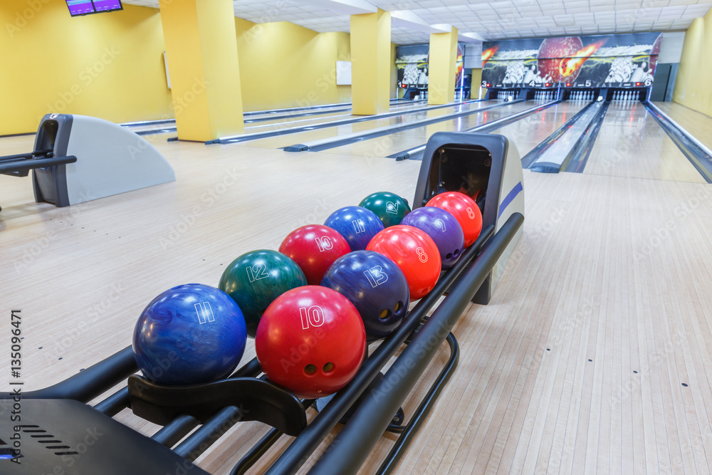 Bowling balls return machine, alley background Stock Photo | Adobe Stock