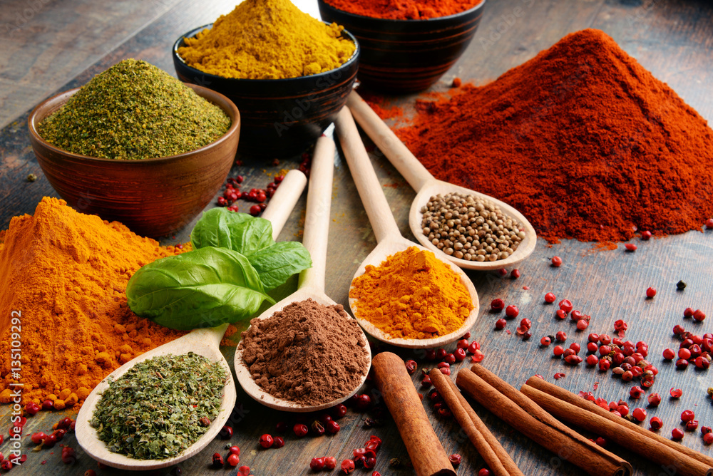 Variety of spices on kitchen table Stock Photo | Adobe Stock
