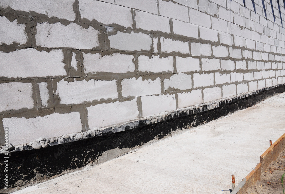 Waterproofing and insulationhouse foundation wall. Waterproofing house ...