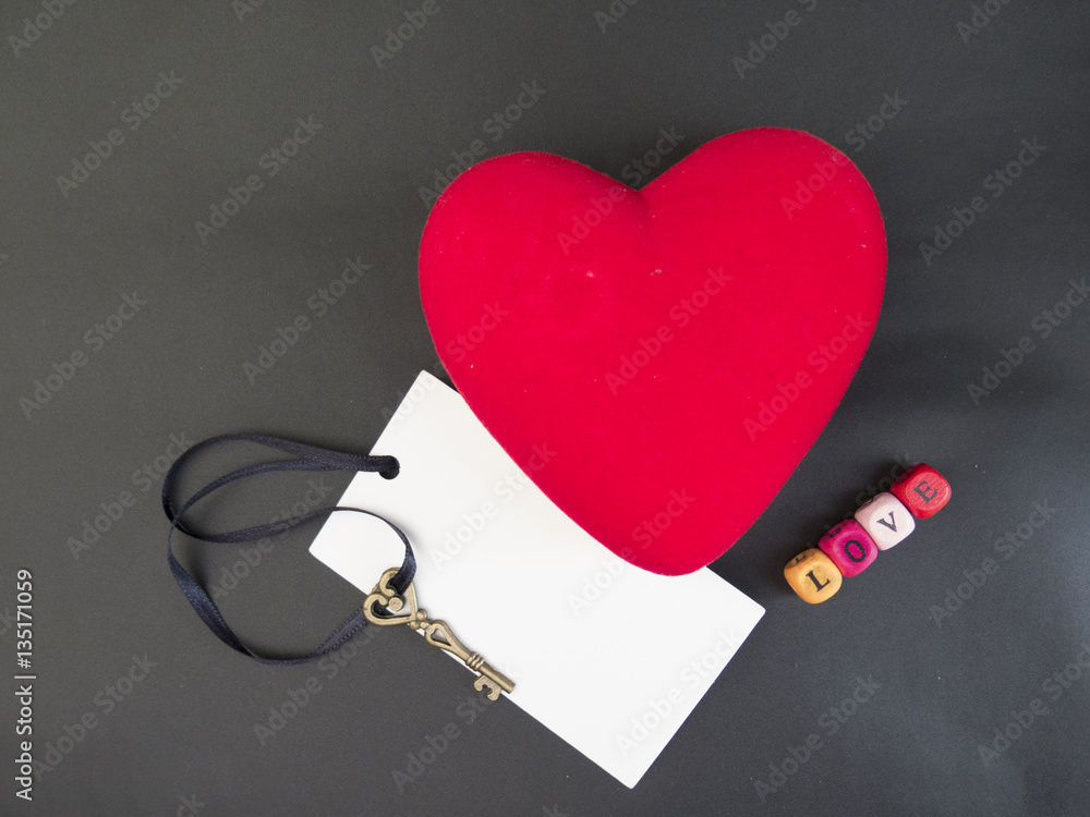 red heart with a card and a key on a black background Stock Photo ...
