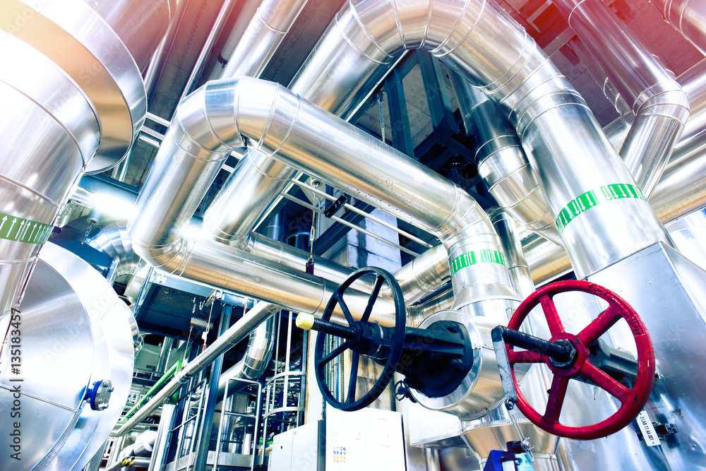 different size and shaped pipes and valves at a power plant Stock Photo ...