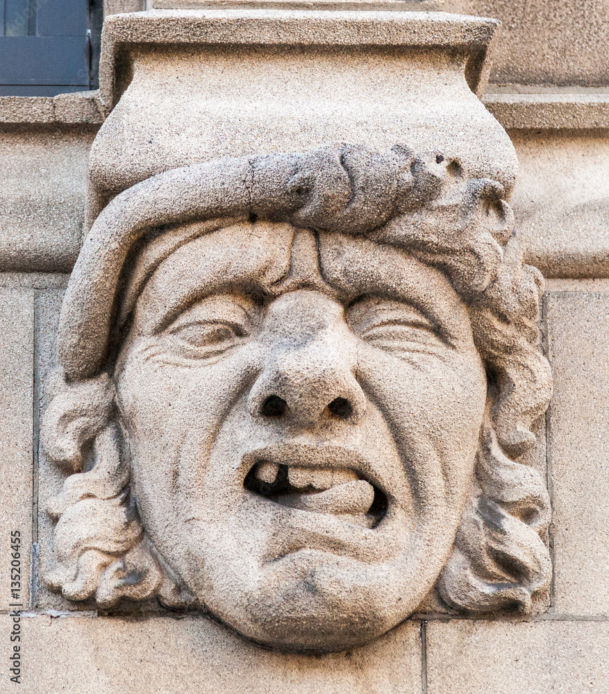 squinting gargoyle with bad teeth Stock-Foto | Adobe Stock