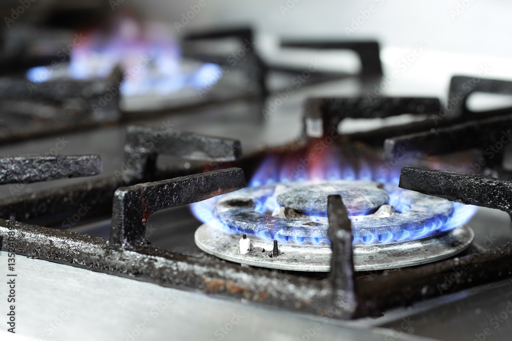 Fire on a kitchen gas stove Stock Photo | Adobe Stock