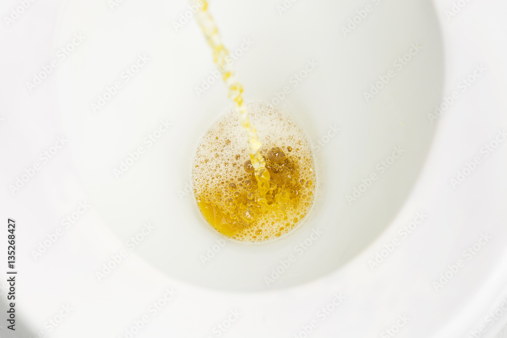 Release or pouring urine or pee in white flush bowl toilet in re Stock ...