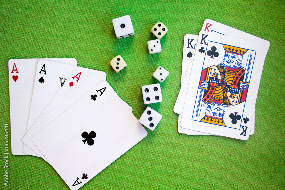 cards and dice on green background Stock-Foto | Adobe Stock