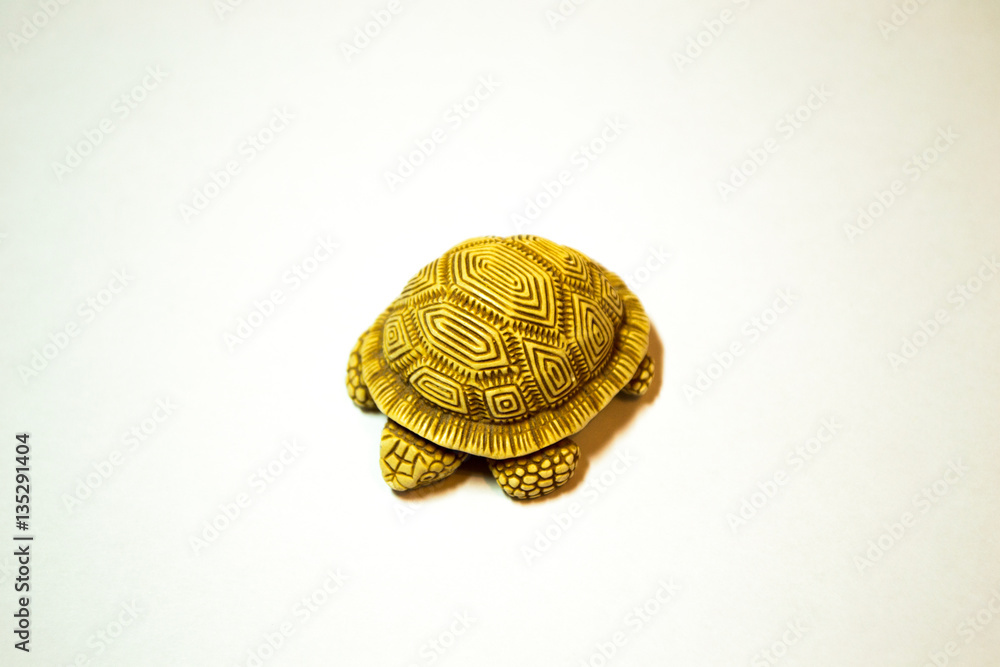 Netsuke turtle isolated on white background Stock Photo | Adobe Stock