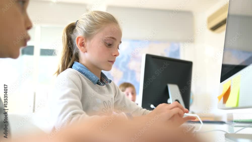 Kids in computer lab working on desktop computer Stock Video | Adobe Stock