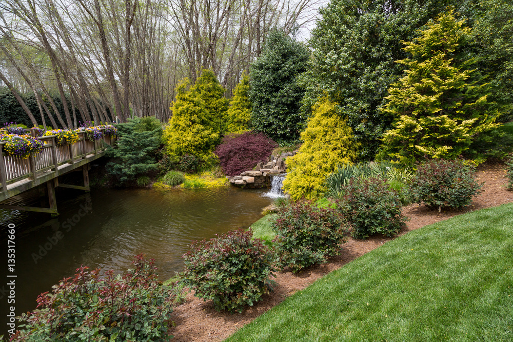 Small Waterfall into Pond by Bridge Stock Photo | Adobe Stock