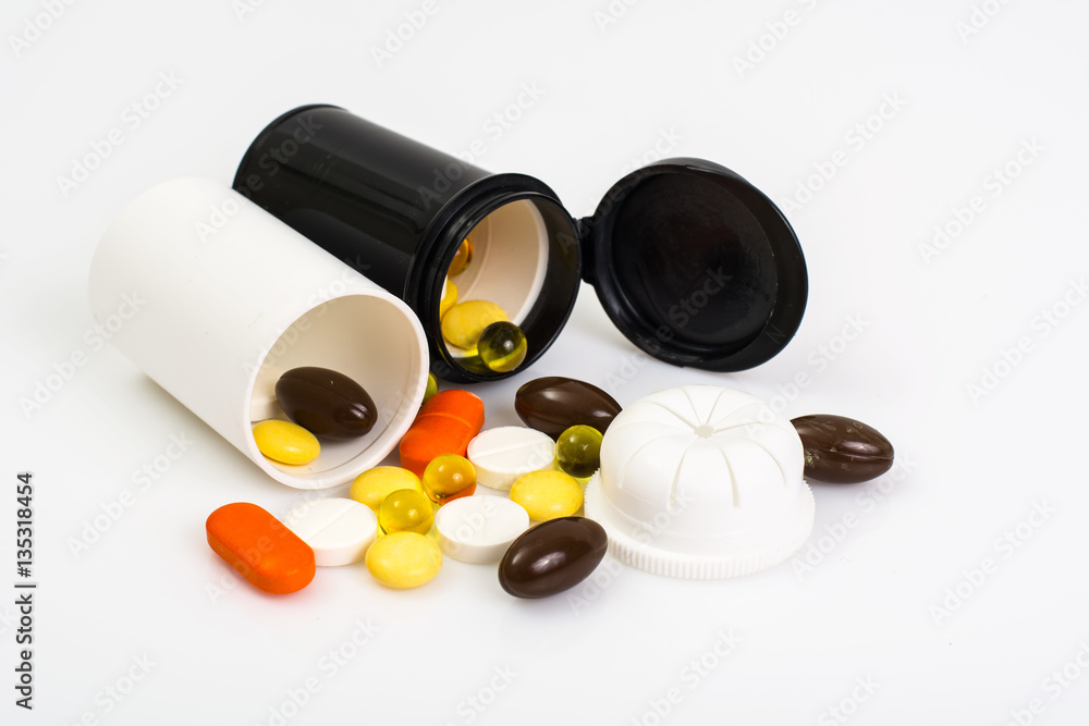 Colored Capsules, tablets and pills in a plastic jar Stock Photo ...