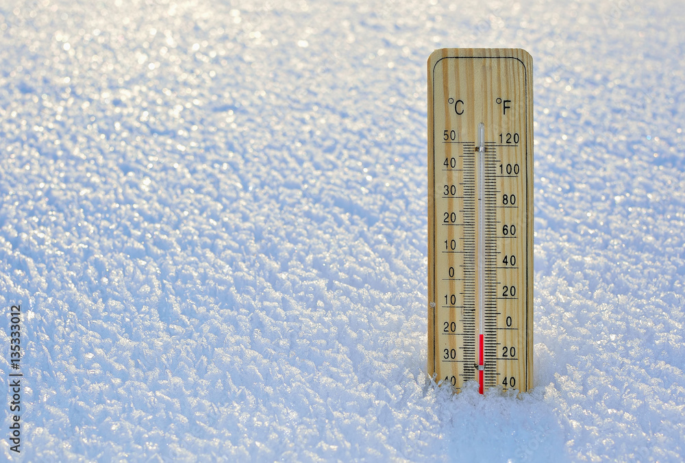 Mercury wooden thermometer stuck on snow shows very low temperatures ...