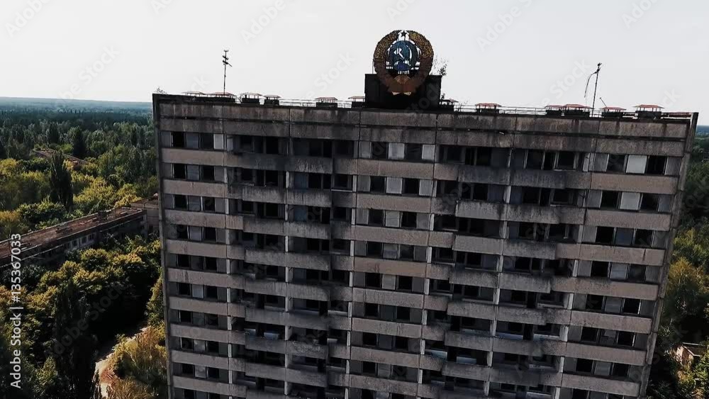 Abandoned building with the Soviet coat of arms on the facade in the ...