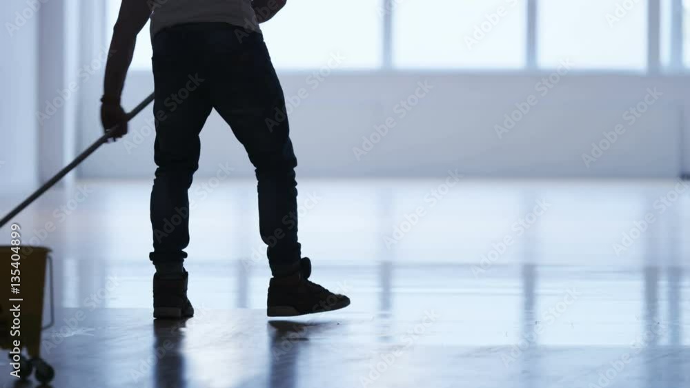 Man Cleaning the Floor in a Gym Stock Video | Adobe Stock