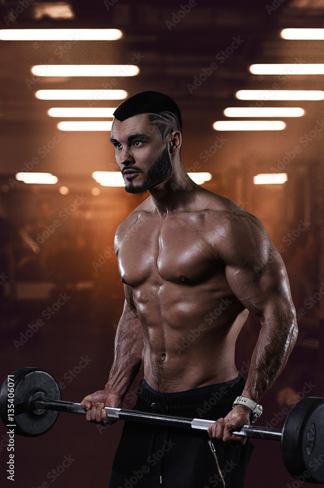 Muscular bodybuilder working out in gym Stock Photo | Adobe Stock