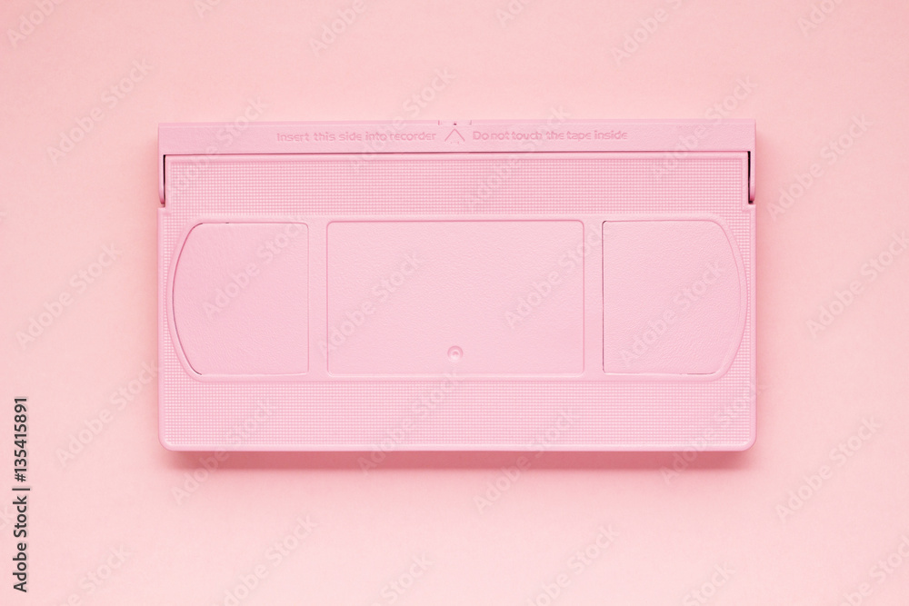 Retro wave / Creative photo of painted VHS cassette on pink background ...