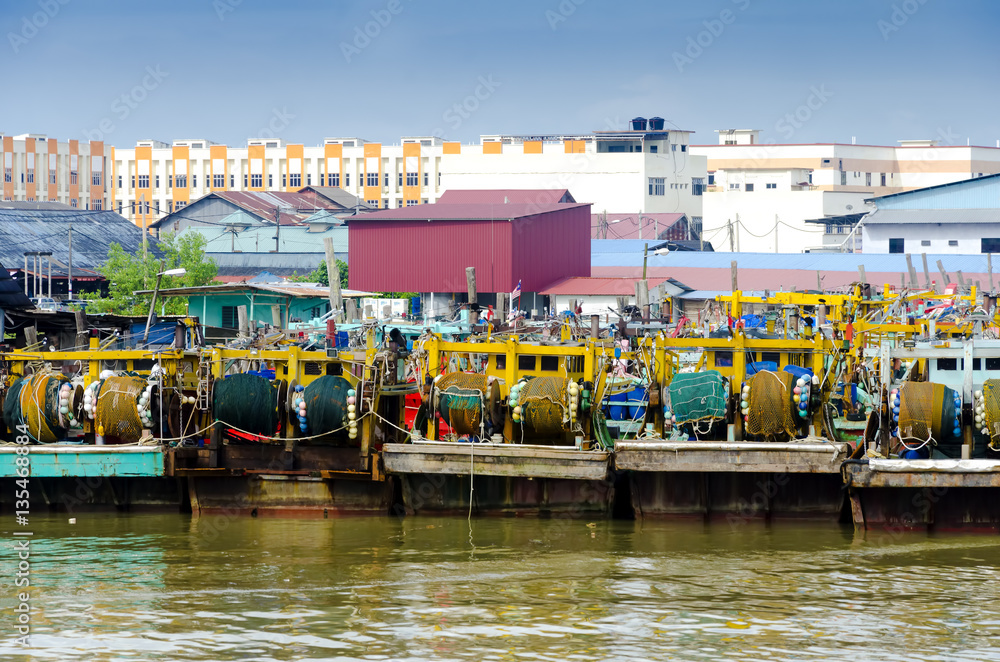 JOHOR, MALAYSIA - JANUARY 30, 2017: Fishing boats anchored at the jetty ...
