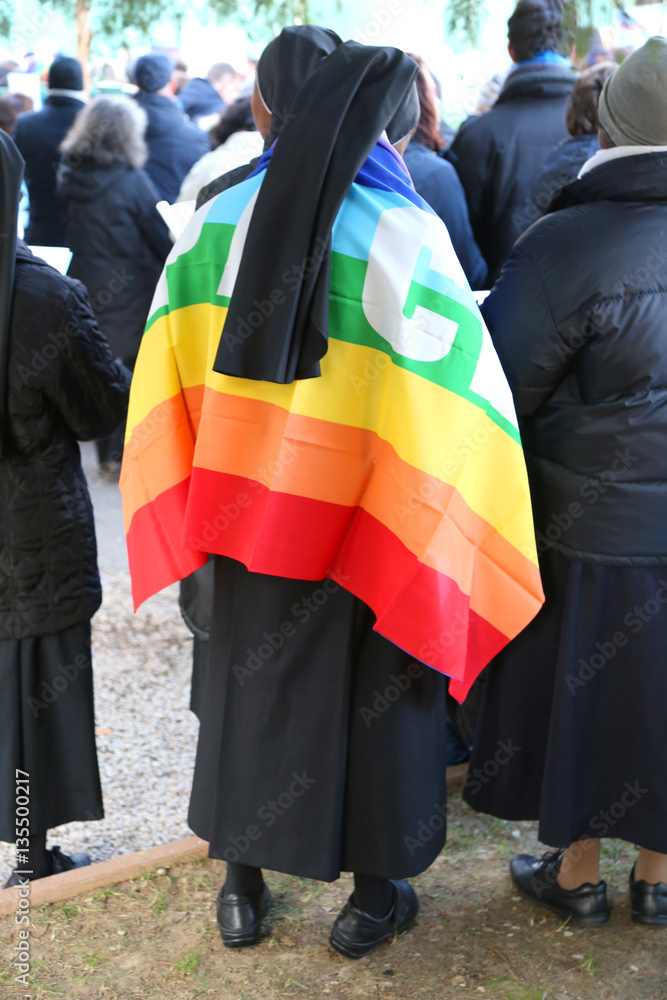 group of nuns with black veil and colored flag of peace Stock Photo ...