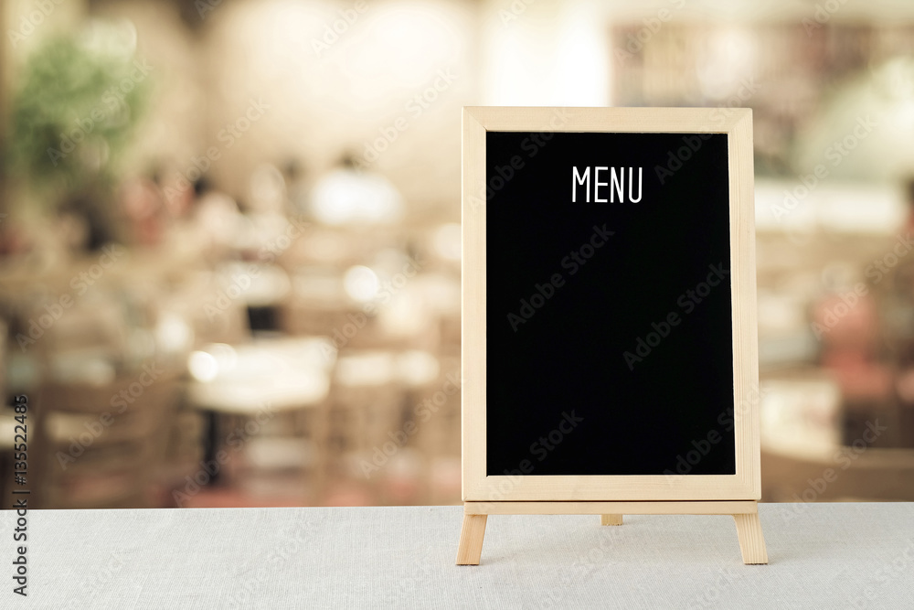 Blank menu board over blur cafe background Stock Photo | Adobe Stock