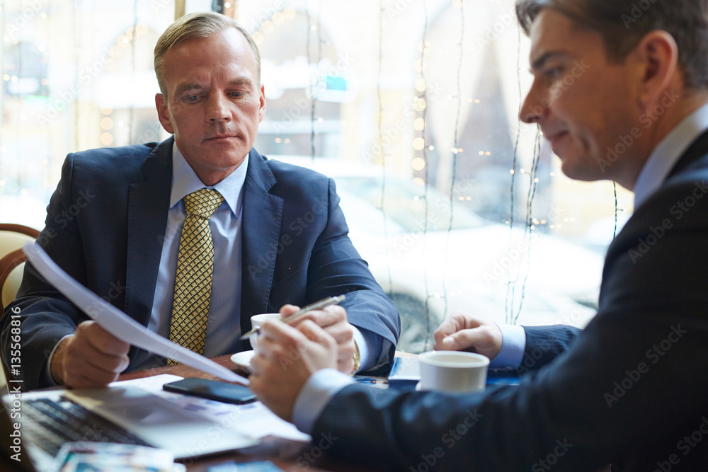 Reading document Stock Photo | Adobe Stock