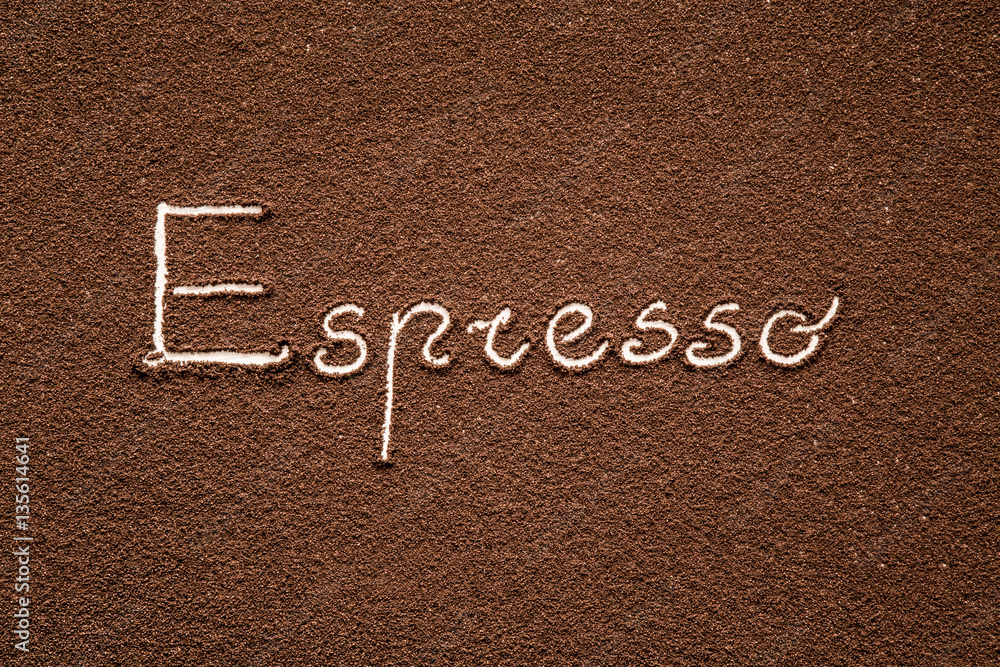 Word espresso created from ground coffee in the kitchen. Enjoying a ...