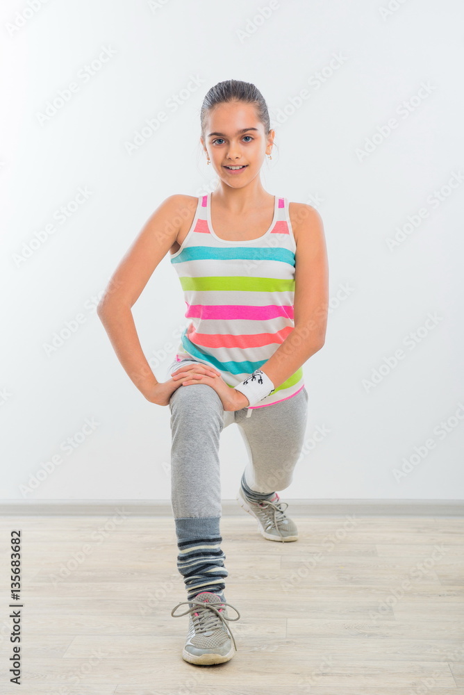 Beautiful teenage girl doing stretching exercises, Beautiful teen girl ...