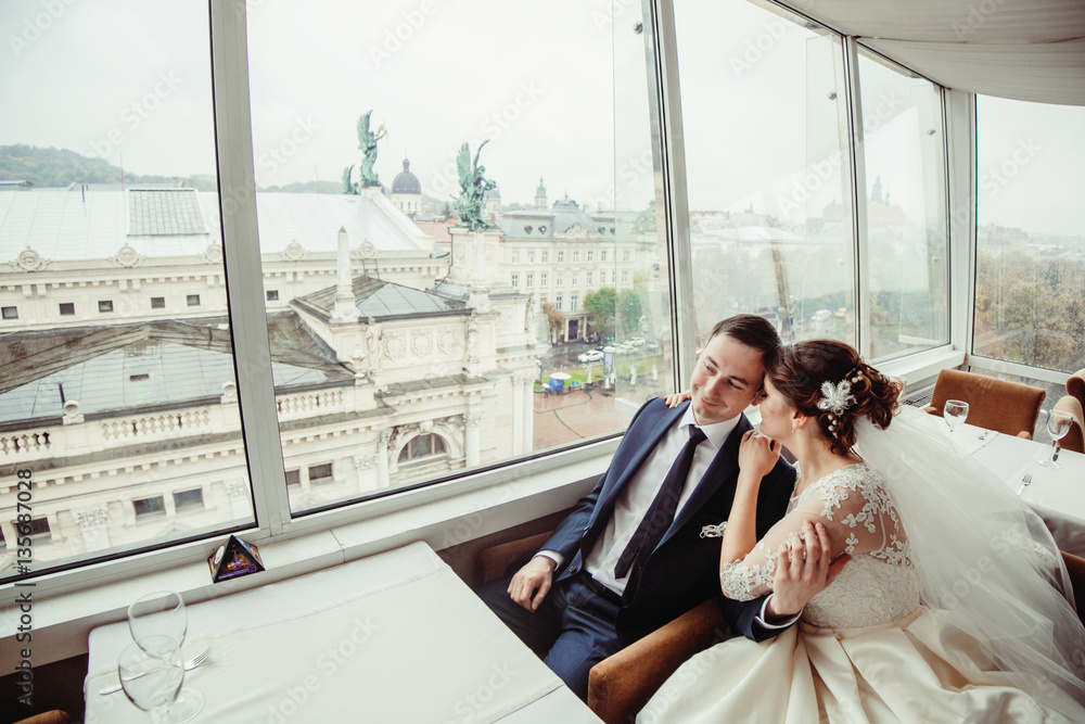 The lovely couple in love sitting on the chairs Stock Photo | Adobe Stock