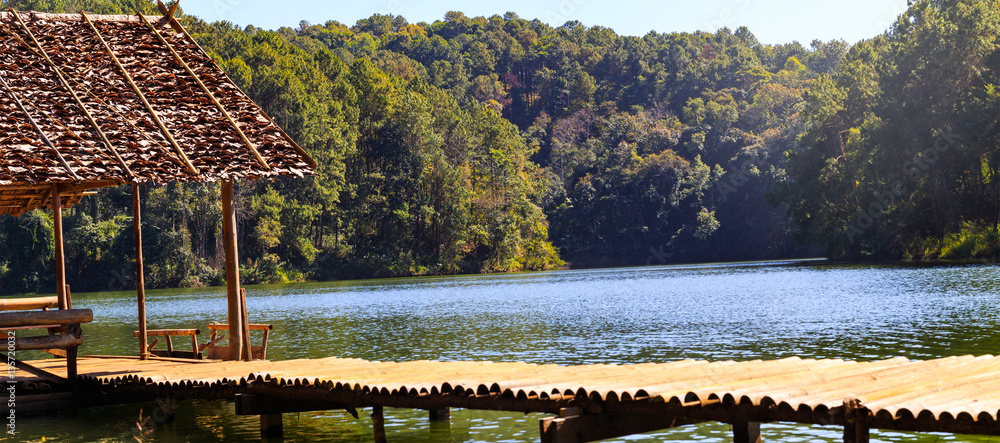 Bamboo bridge and hut in lake and camping site with pine trees Stock ...