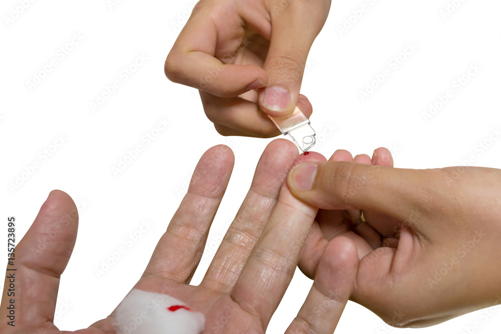 Woman drawing blood from fingertips of man,white isolated. Close up of ...