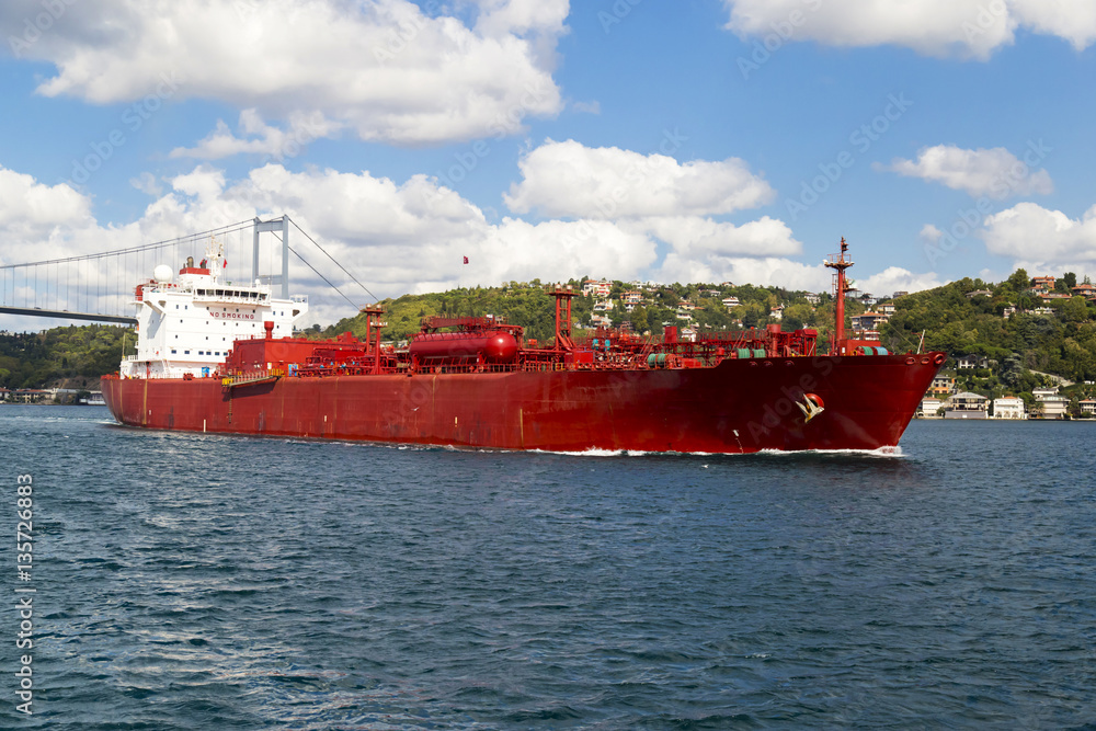 Big size commercial ship view from Istanbul Bosphorus with blue sky ...