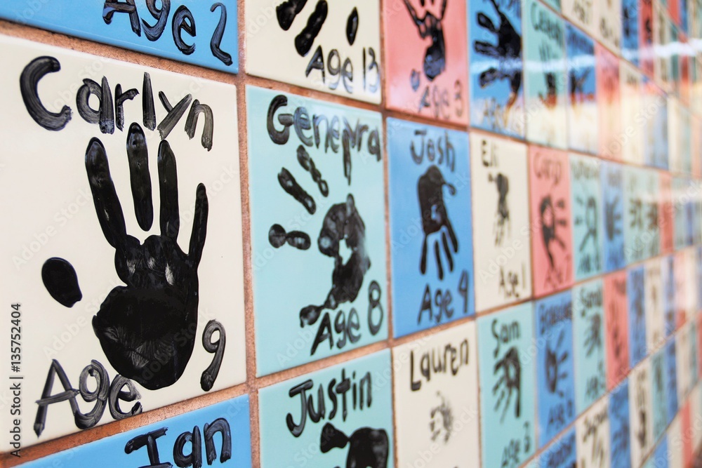 Close Up of A Colorful Tiled Wall with Children's Handprints, First ...