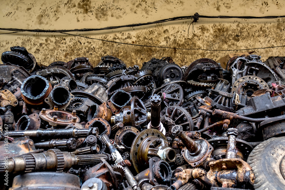 Pile of Used machine parts are oily and rusty in second hand machinery ...