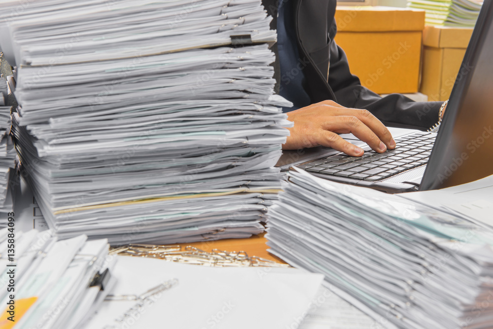 documents on desk stack up high waiting to be managed Stock Photo ...