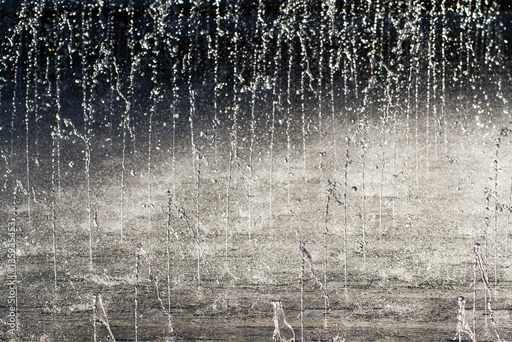 A water background showing jets and streams of cold, clear water ...