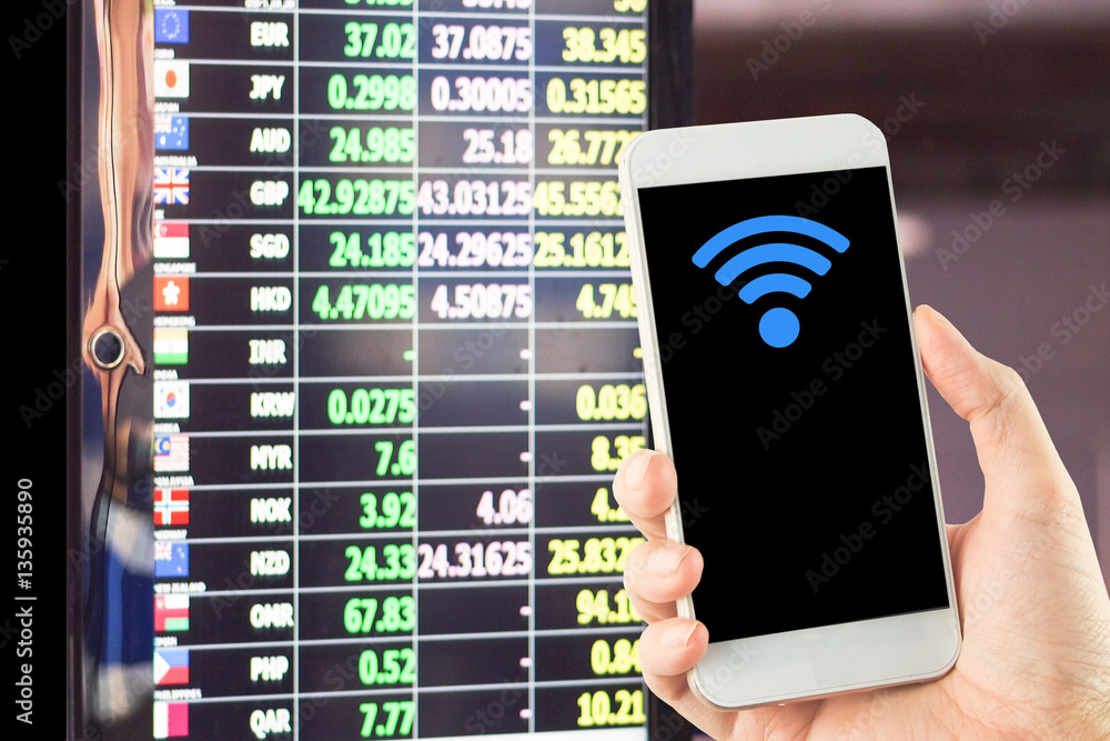 smartphone in hand wi-fi icon exchange money rate board ,international ...