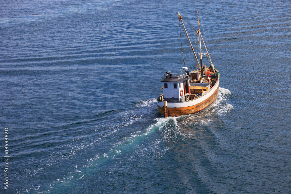 Old wooden fishing boat trawler on sea. Stock Photo | Adobe Stock