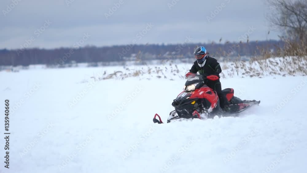 Stockvideo Man driving snowmobile in snowyfield. Snowmobile races. Man ...