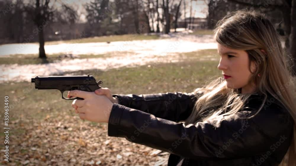 Female Secret Agent aims pistol at off camera object Action Movie Shots ...