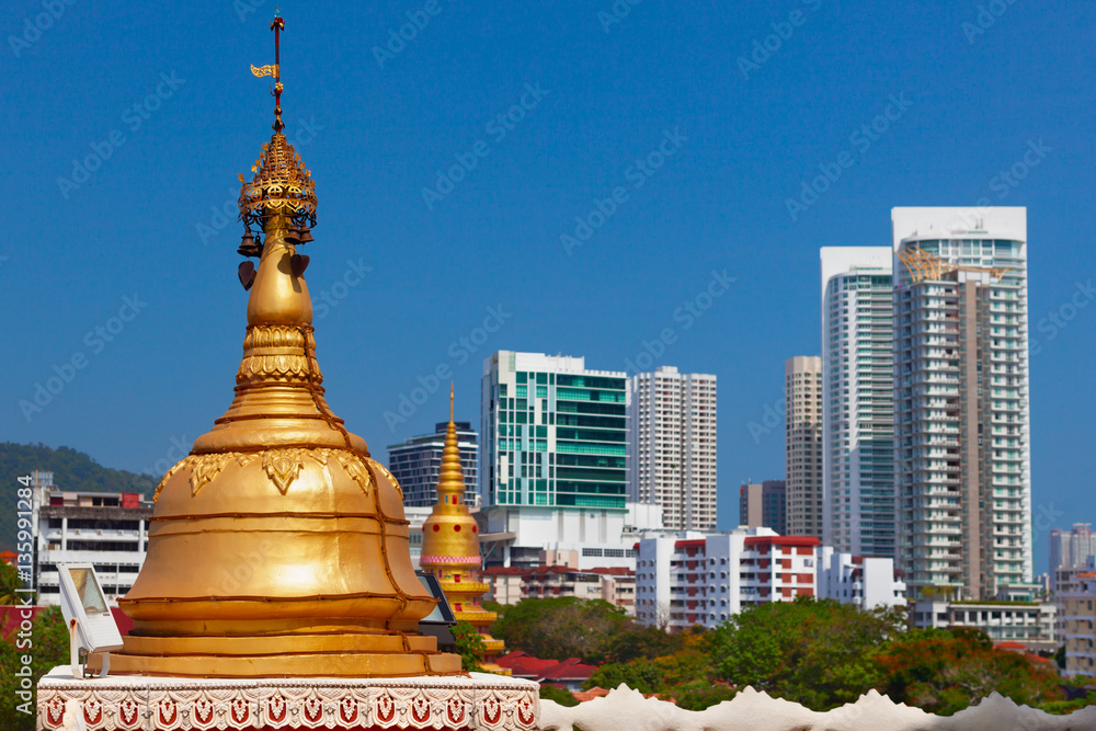 Golden buddhist stupa on modern city buildings background. Pagoda ...