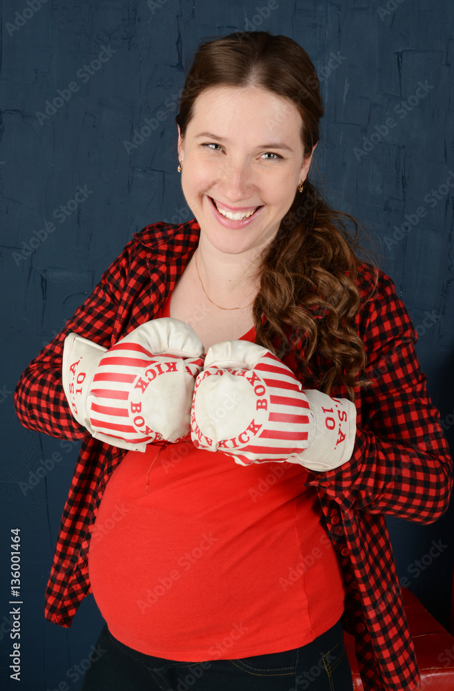 Pregnant woman with boxing gloves Stock Photo | Adobe Stock