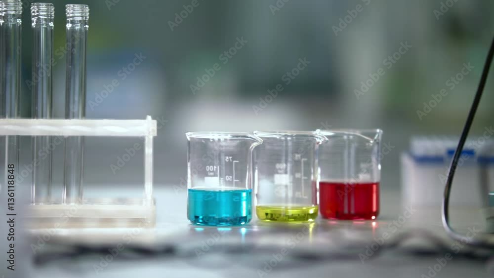 Laboratory glassware in chemical lab. Panning on measuring cups and lab ...