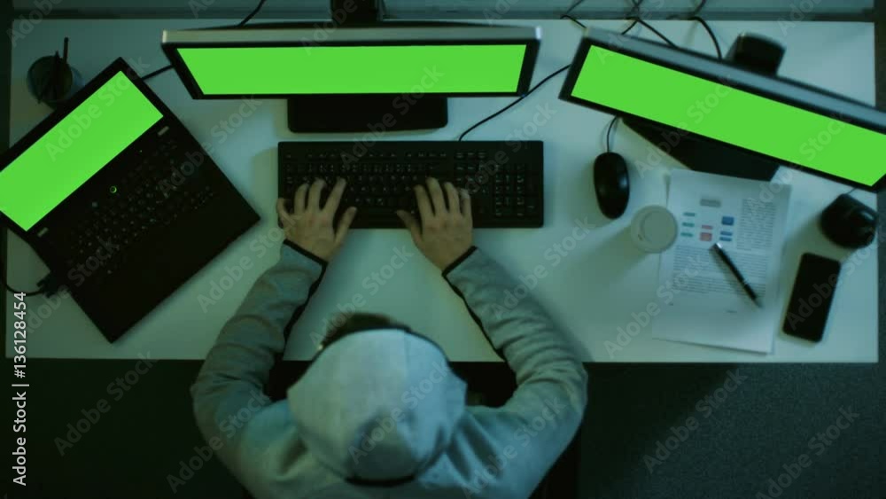 Top View of a Hacker Breaking into International Datacenter. His Two ...